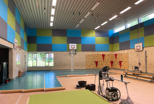 Impact resistant acoustic panels install in school hall